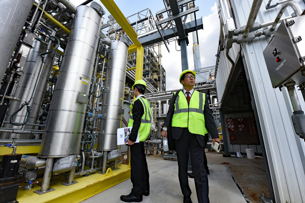 IEAGHG PCCC4 Conference attendees walk through a testing skid at the ...